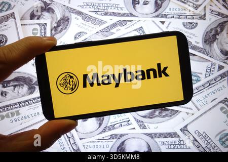 In this photo illustration, the Maybank company logo is seen displayed ...