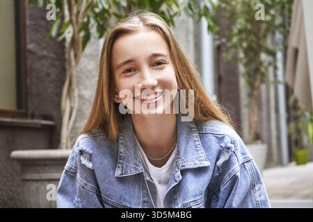 Photo of positive pretty girl direct finger arm hold controller offer ...