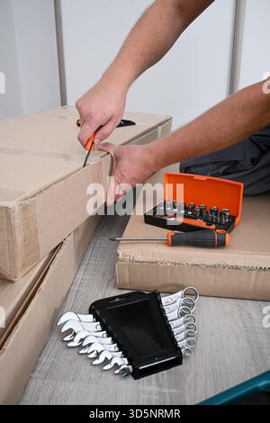 Handyman preparing tools for home improvement Stock Photo - Alamy