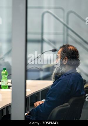 Taleb al-Abdulmohsen sits in a glass box during the trial at the ...