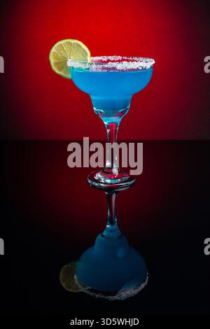 A vibrant blue cocktail with salted rim vertical Stock Photo - Alamy