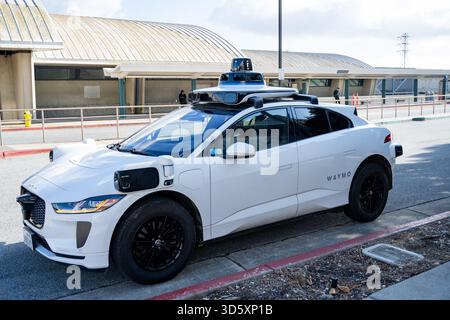 Waymo autonomous electric vehicle with roof-mounted lidar sensors ...