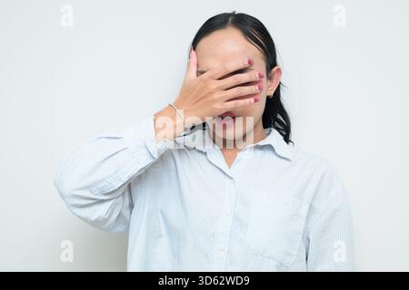 That was an epic fail. Studio portrait of a young woman showing a loser ...
