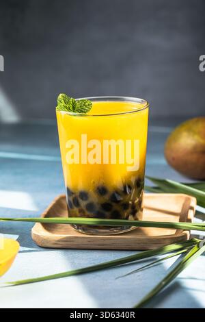 Refreshing mango lassi smoothie with boba pearls, creamy tropical drink ...