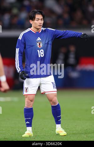 Ayase Ueda #18 of Japan national team runs whit the ball during the ...