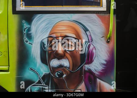 KENYA, Nairobi, Graffiti street art and traffic, colorful painted SACCO ...