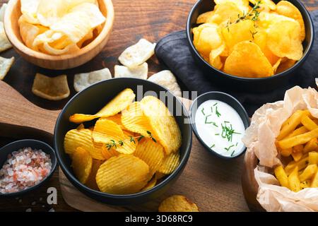 Potato corrugatedchips. Fast food. Crispy potato chips ceramic black ...