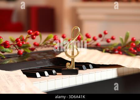 Golden treble clef, music sheets and Christmas decor on gray textured ...