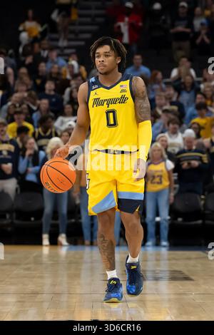 Marquette guard Nigel James Jr. (0) shoots the ball against Wisconsin ...