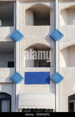Typical white house facade part in italian city near the sea ...