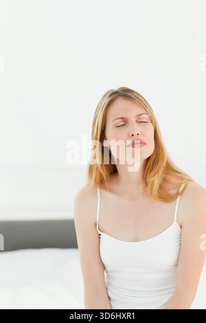 Blonde caucasian woman wearing sleep mask and pajama showing and ...