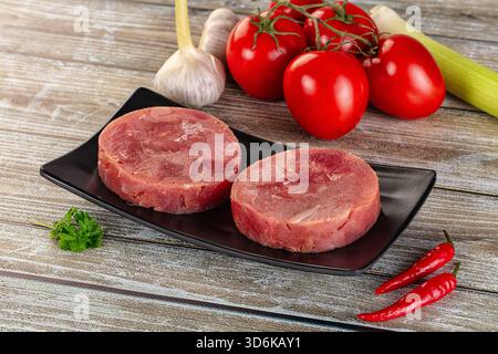 Raw round tuna fish uncucked fillet Stock Photo - Alamy