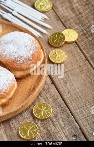 Happy Hanukkah. Hanukkah sweet doughnuts, gift boxes, white candles and ...
