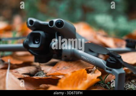 A closeup of DJI Mini 3 Pro drone flying on sunny fall day Stock Photo ...