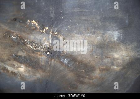 Dirty damaged black work pants with stains showing heavy labor use ...