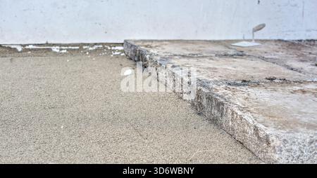 Large old concrete tile blocks on layer of sand - pavement construction ...
