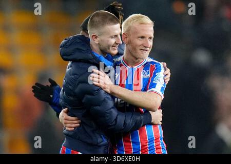 Crystal Palace's Adam Wharton, left, and Arsenal's Eberechi Eze fight ...