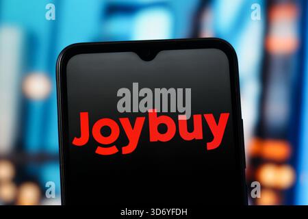 In this photo illustration, the Joybuy logo is seen displayed on TV ...