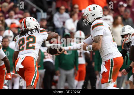 Miami running back Girard Pringle Jr. (22) carries as he's defended by ...