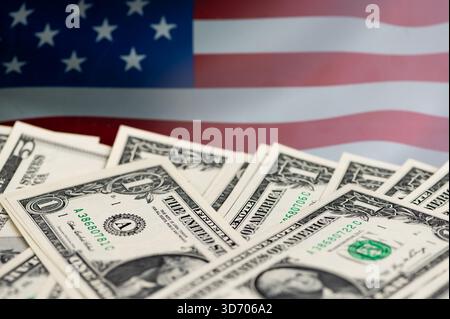 Banknotes are spread across the table near the US flag Stock Photo - Alamy