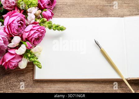 Vintage sheets of paper and bouquet of flowers, copy space. Blank space ...