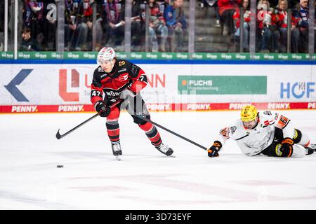Owen Headrick (Nuernberg Ice Tigers, #47) in front of Brady Ferguson ...