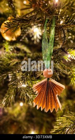 Paper fairy decoration hanging from twigs Stock Photo - Alamy