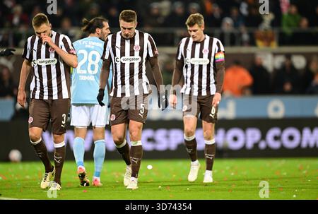 from left: Eric Smith, Karol Mets, goalkeeper Nikola Vasilj (St. Pauli ...