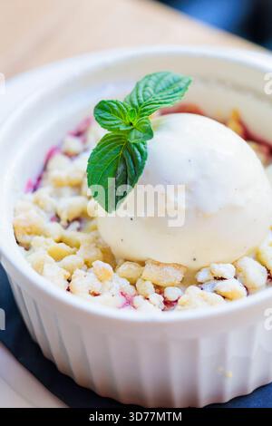 Delightful Berry Dessert With Creamy Ice Cream on a Rustic Wooden Table ...