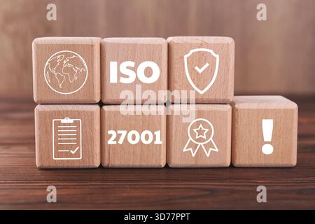 ISO 27001 Information security management systems. Wooden cubes with ...