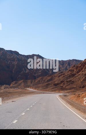 Road Winding Through Towering Red Sandstone Canyon Walls in Utah Stock ...