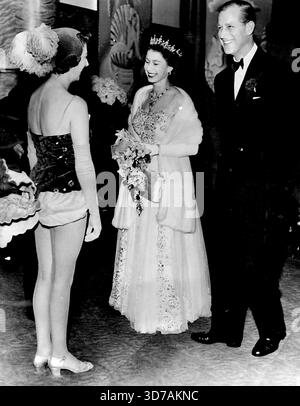 Scantily clad artiste Miss Sylvia Plake is presented to Queen Elizabeth ...