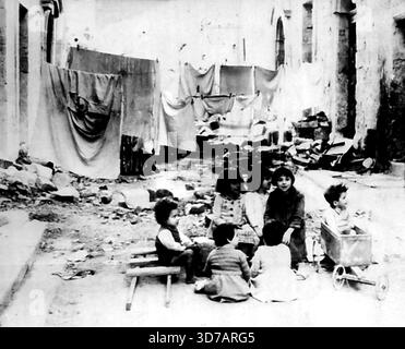 File - Children play war in the ruined Catholic quarter of Falls Road ...