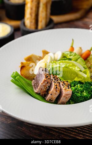 a food bowl with mixed vegetables and dressing, overhead view Stock ...
