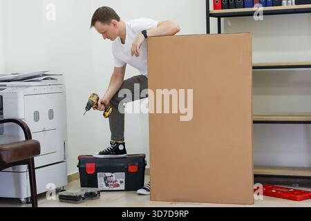 Cardboard box with sneakers on yellow background, closeup Stock Photo ...