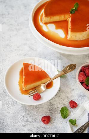 Custard with egg custard caramel flan dessert with raspberries Stock ...