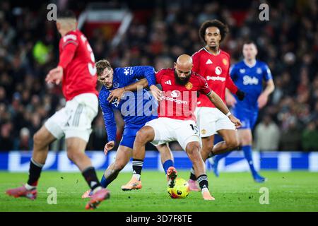 Bryan Mbeumo of Manchester United is tackled by Abdukodir Khusanov of ...