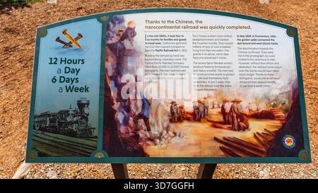 Historic interpretive sign describing the Chinese building the ...