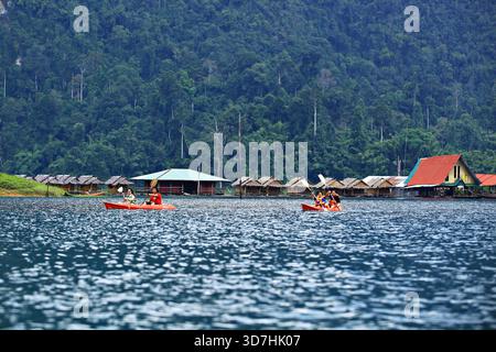 Surat Thani, Thailand - 21 January 2012: Tourists joyfully paddling a ...