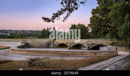 Sunrise at Blagdon Lake Dam Bridge with very low water levels, also ...
