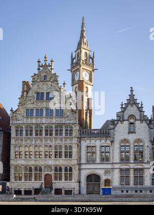 Historic waterfront buildings with a clock tower next to a modern ...