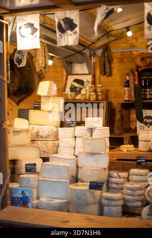 Paris, France; December 28 2025: Female vendor at a traditional ...