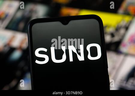 In this photo illustration, the Suno logo is displayed on a cell phone ...