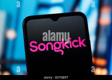 In this photo illustration, the Songkick logo is displayed on a cell ...