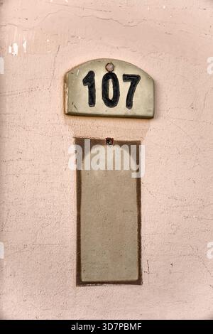 Hotel room number mounted on a wall Stock Photo - Alamy
