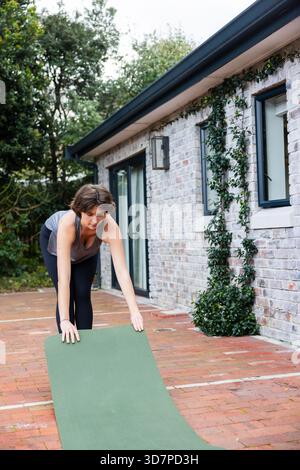 Red brick wall and green plants in the garden Stock Photo - Alamy
