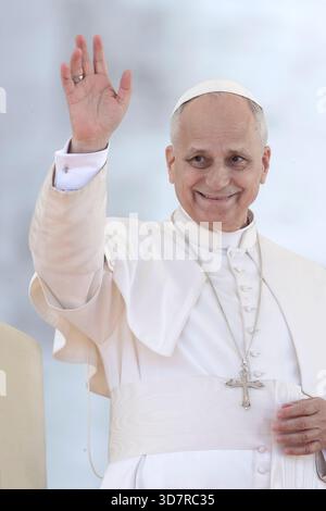 Pope Leo XIV waves during the Angelus noon prayer from the window of ...