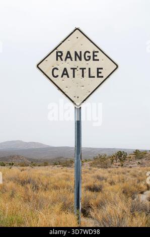 Bullet riddled sign in cattle country Stock Photo - Alamy