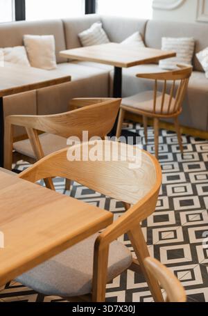 Sofa with pillows on wooden floor Stock Photo - Alamy