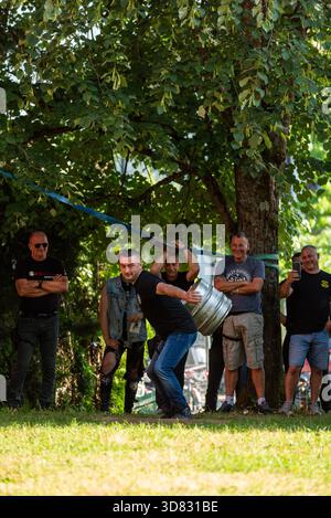 Draft keg throwing contest at moto camp in Prnjavor during moto meet ...